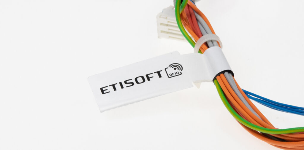Flag label application. How to automate the labelling of long products ...